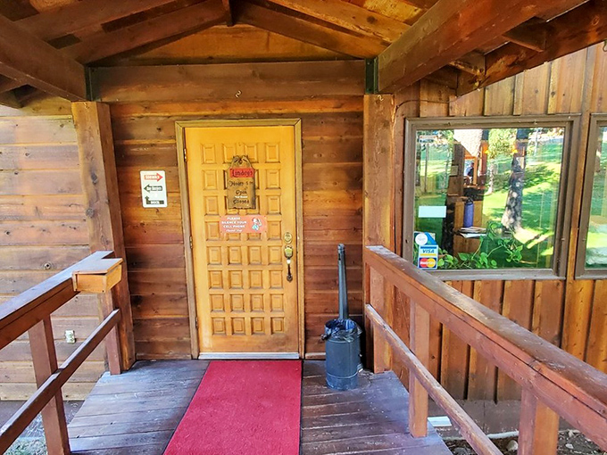 The yellow door beckons like a treasure chest. Cross this threshold and prepare for a steakhouse experience that defines Montana dining at its finest.