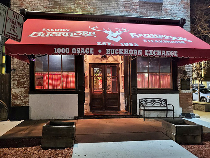 At night, the Buckhorn's entrance glows with promise, like a portal to a time when dinner required significantly more courage than it does today.