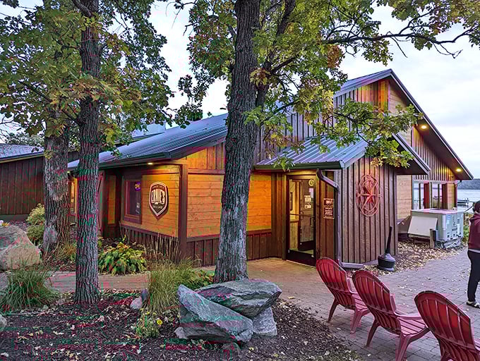 As evening approaches, Ernie's wooden exterior glows with warm light, promising memorable meals beneath Minnesota's changing leaves.
