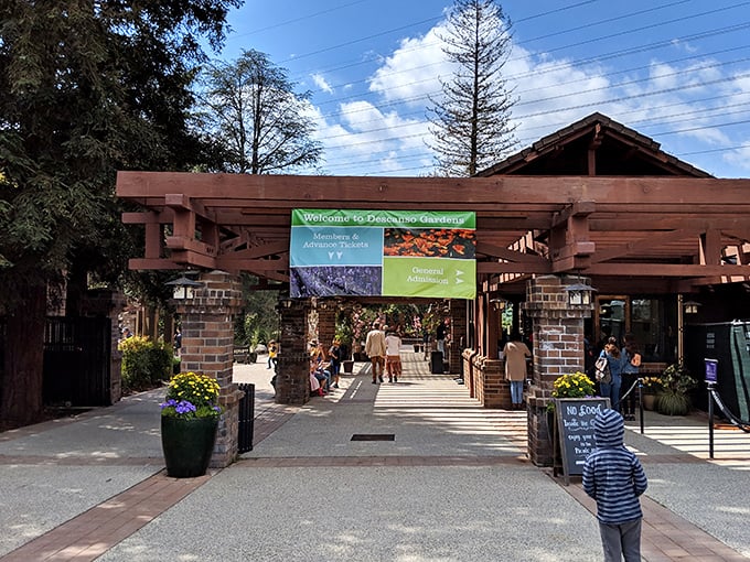 The welcoming entrance beckons you inside, promising 150 acres of botanical beauty just beyond those rustic wooden gates.