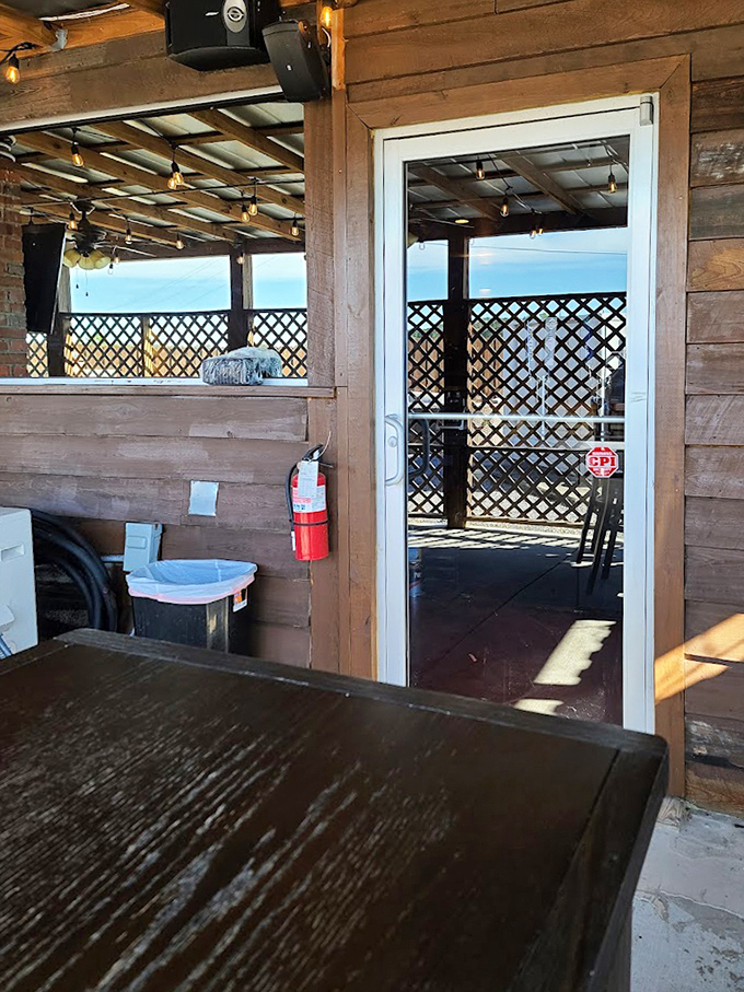 The patio entrance beckons with promises of fresh air and the same exceptional dining experience, just with a side of South Carolina sky.