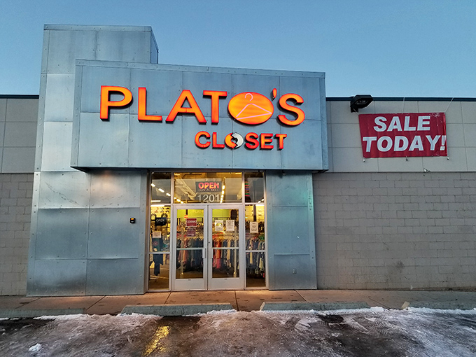 As dusk settles over Anchorage, Plato's Closet glows like a beacon of budget-friendly fashion hope against the winter darkness.