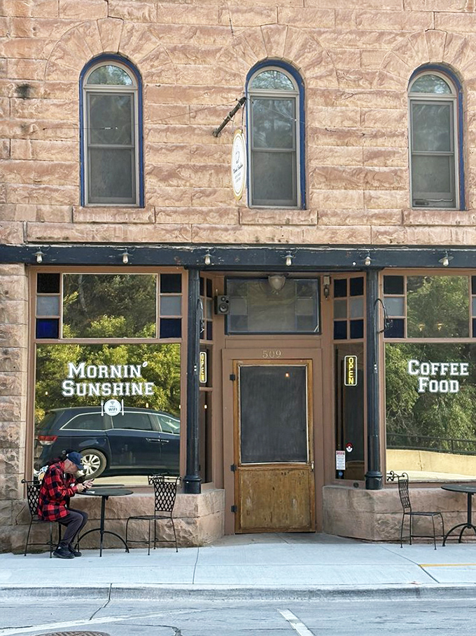 The entrance says "historic building," but the neon "OPEN" sign whispers "get in here and eat something wonderful already."