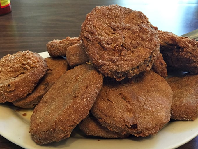 Fried eggplant rounds stacked like delicious poker chips. Crispy outside, creamy inside&mdash;these unexpected Southern treasures might steal the show from the chicken.