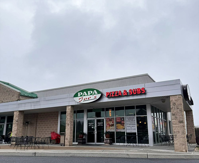 The final approach to flavor town. That green and red signage serves as a beacon for hungry travelers seeking authentic Italian-American goodness.