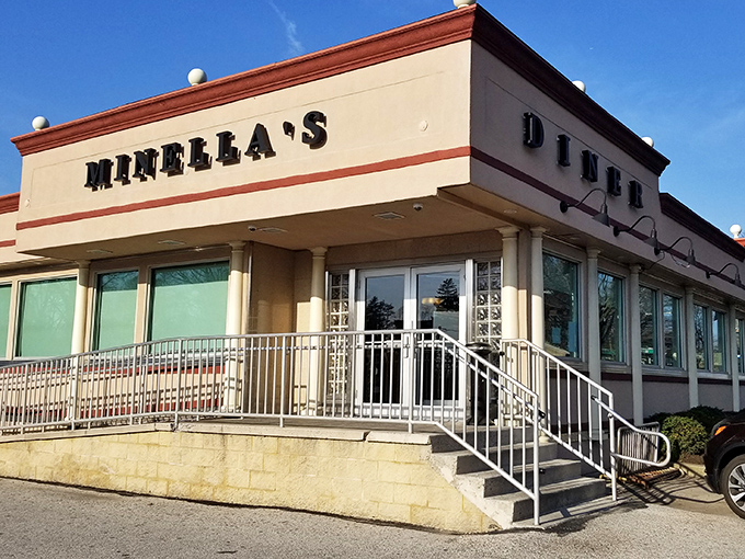 Minella's fa&ccedil;ade gleams in the sunshine, its clean lines and classic signage promising the timeless pleasures waiting inside.