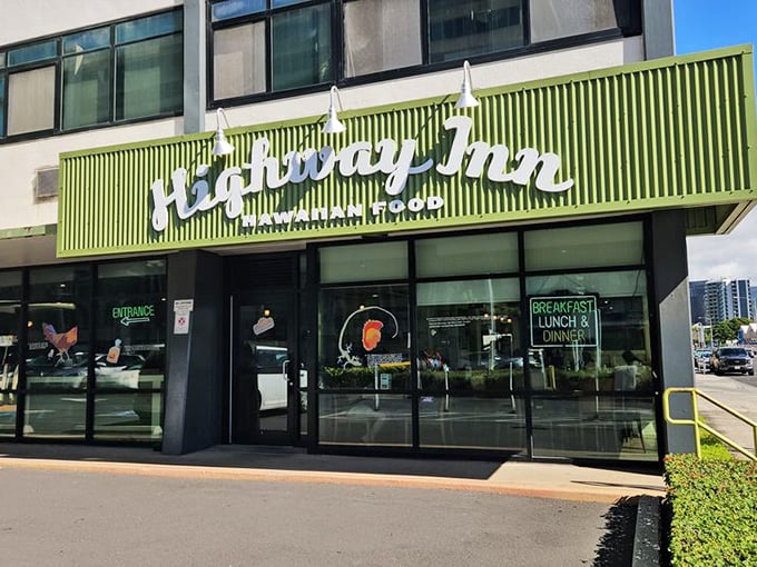That distinctive green signage stands out against Honolulu's urban landscape like a beacon for hungry souls seeking Hawaiian comfort food.