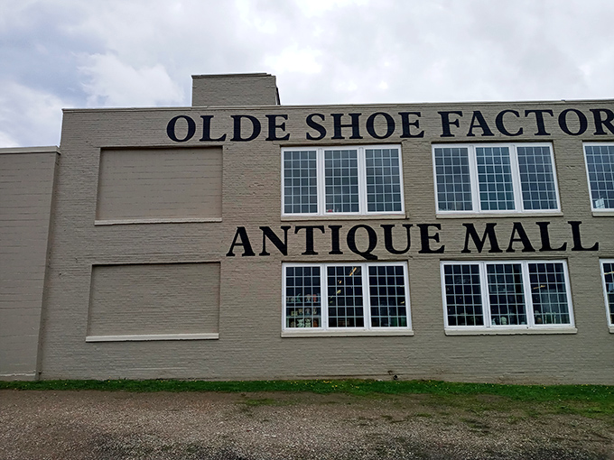 The imposing facade announces its purpose with no-nonsense clarity. Once shoes walked out; now memories walk in.