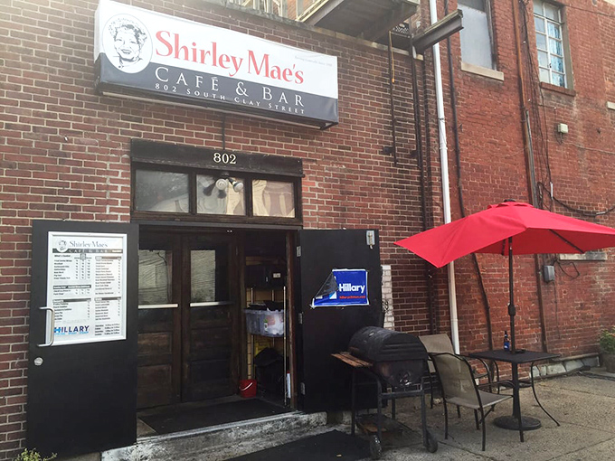 The front entrance &ndash; your portal to pork chop paradise. That red umbrella isn't for rain; it's a beacon guiding hungry pilgrims home.
