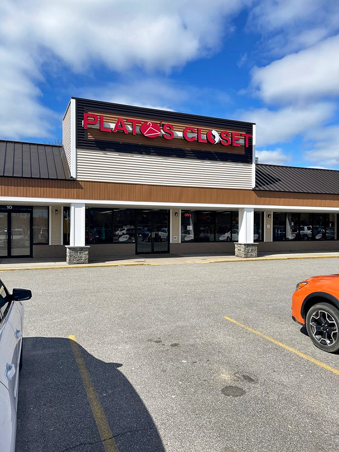 The bright red Plato's Closet sign stands against Maine's blue sky like a beacon for bargain hunters and sustainable fashion seekers alike.