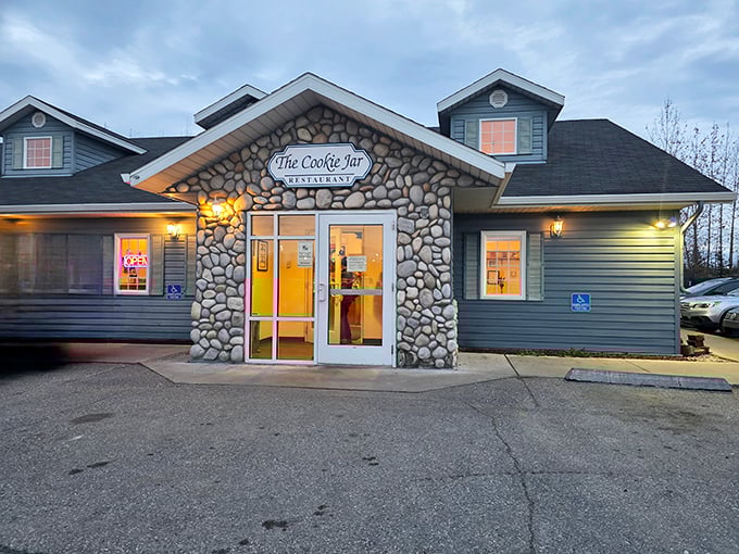 As evening approaches, The Cookie Jar's warm lights beckon through Fairbanks' early darkness, promising that comfort food awaits just beyond those stone walls.