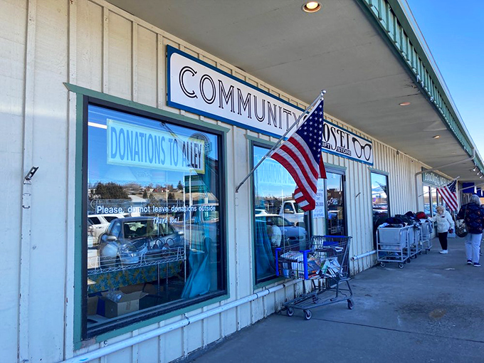 The welcoming facade with its "Donations to Alley" sign and American flags&mdash;a community hub where one person's discards become another's discoveries.