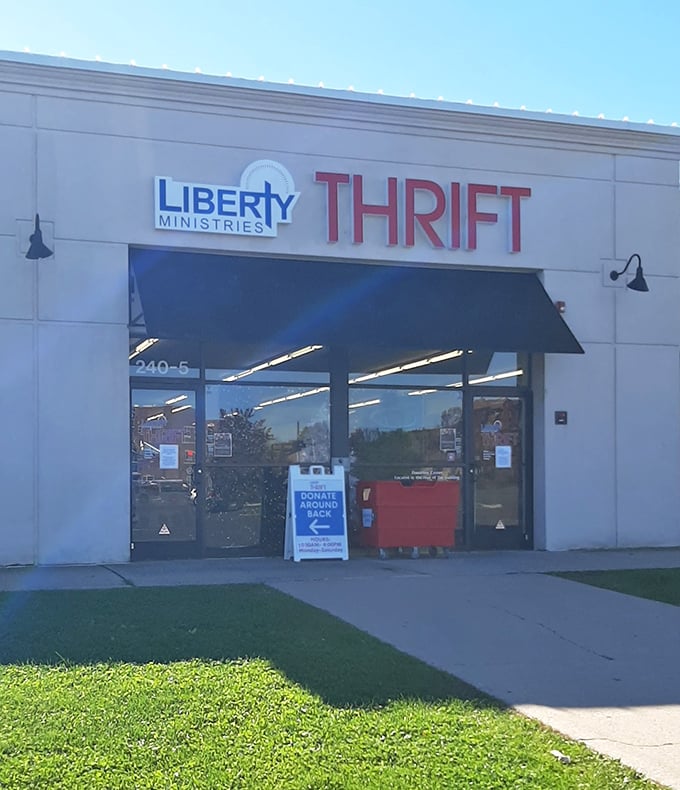 The welcoming entrance to bargain paradise, where the "Donate Around Back" sign hints at the constant renewal of treasures within.