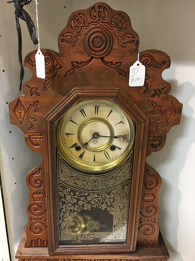 An ornate wooden clock with craftsmanship that makes modern timepieces look like they were assembled by distracted robots.