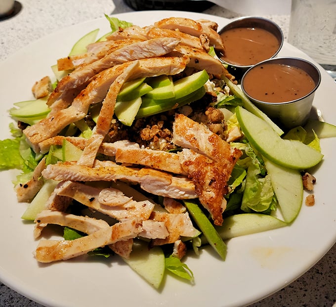 A grilled chicken salad that proves healthy eating doesn't have to be punishment &ndash; fresh greens, sliced apples, and protein that actually tastes like something.