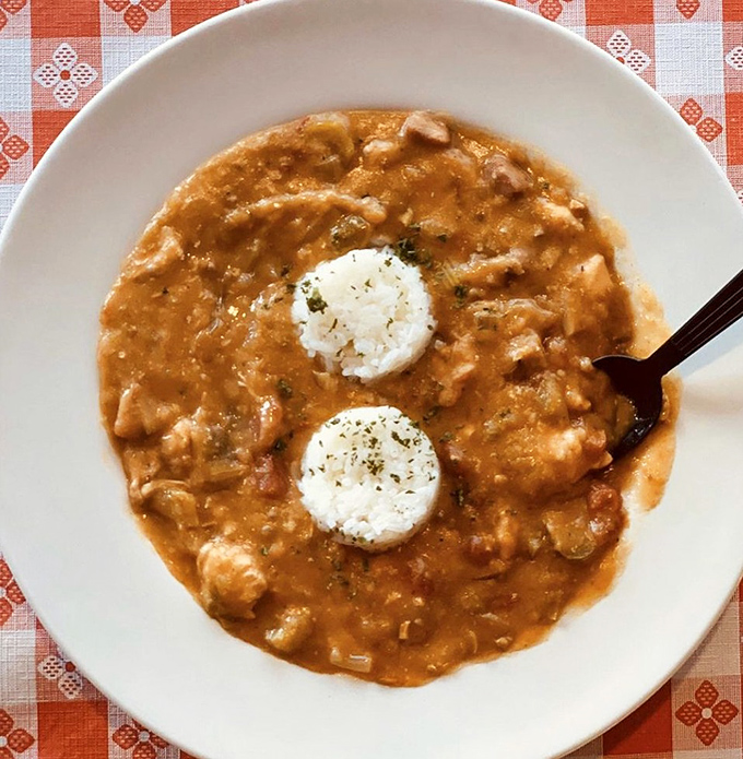 Gumbo that looks like it came straight from someone's grandmother's kitchen in Louisiana. Those rice islands in a sea of flavor tell you everything.