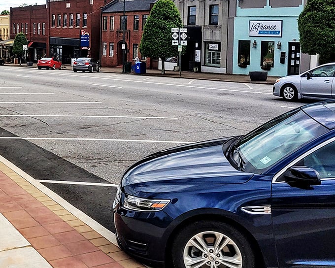 Historic brick buildings line Morganton's main street, housing local businesses that have weathered changing times while maintaining small-town character.