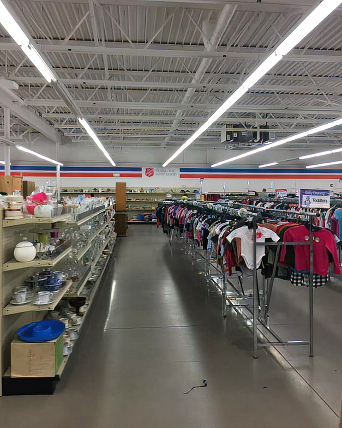 Housewares on the left, children's clothes on the right—a thrifter's paradise where complete kitchen setups cost less than a fancy coffee maker.
