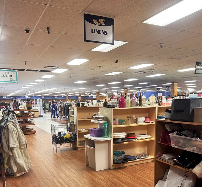 Clear signage guides shoppers through this labyrinth of linens and housewares like breadcrumbs through a forest.