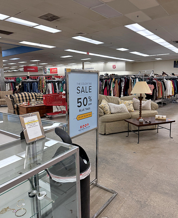 The color-coded tag system—thrifter's secret weapon. Blue tags at 50% off means double the treasures for your budget.