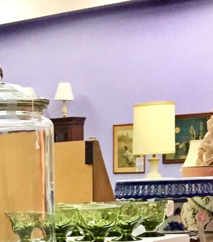 Vintage lamps against lavender walls create the perfect vignette, while green Depression glass catches light like it's still the belle of the 1930s ball. 