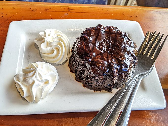 The Molten Lava Cake arrives like the grand finale it is &ndash; chocolate decadence that erupts with warm, gooey goodness. Diet plans surrender immediately.