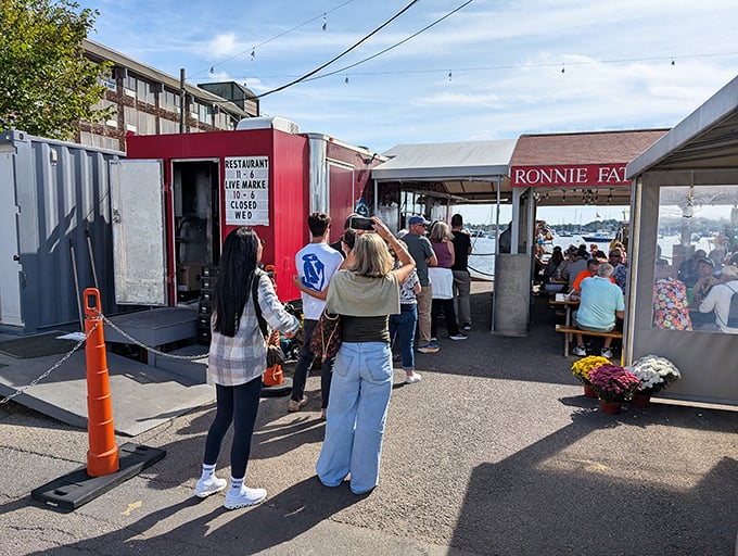 The line of pilgrims on their seafood hajj. Some look anxious, some patient&mdash;all united in the knowledge that transcendent lobster awaits at journey's end.
