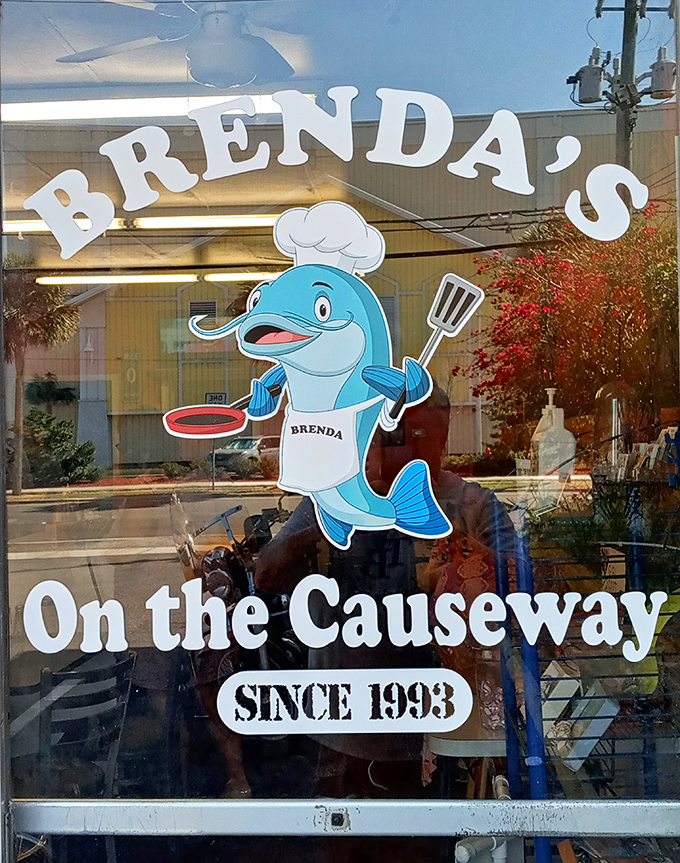 The dolphin chef logo captures Florida charm without the tourist trap vibes. Serving up breakfast with a side of coastal character since 1993.