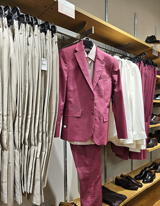 That pink suit isn't just clothing&mdash;it's a statement that says "I got this for 60% off and still look like a million bucks."