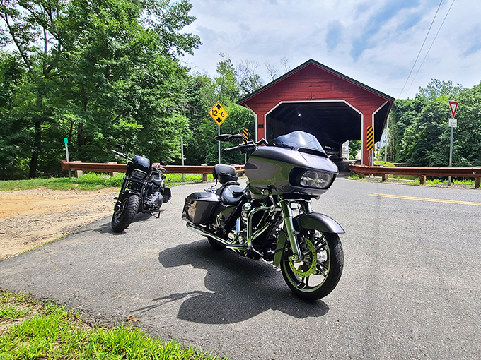 Two wheels, one historic crossing&mdash;motorcycles lined up for their turn through this engineering time capsule.