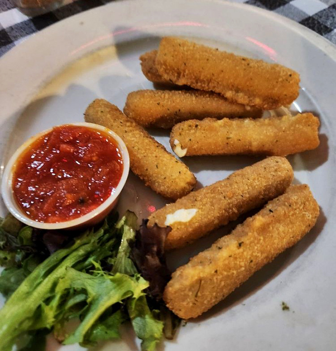 Mozzarella sticks that achieve the perfect cheese pull, served with marinara for dipping&mdash;a starter that threatens to upstage the main course with its simple perfection.