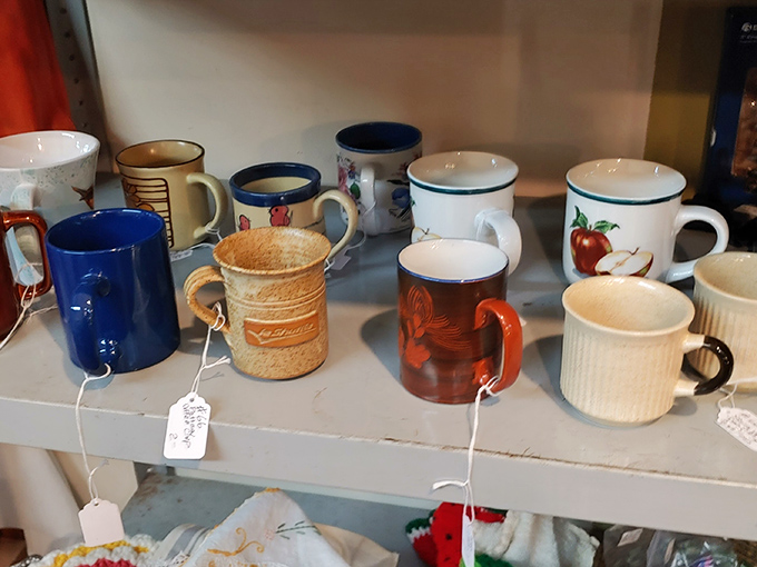 A lineup of mugs that spans decades of morning coffee rituals. That rooster mug has probably witnessed more sunrise grumbles than a farmer's alarm clock.