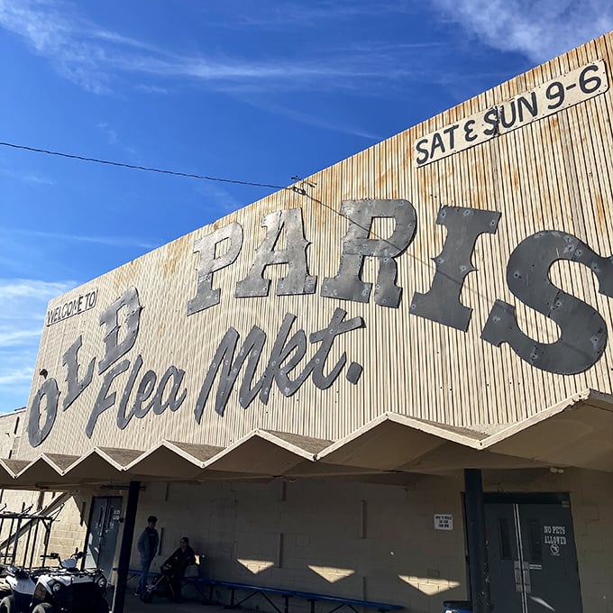 The iconic Old Paris Flea Market sign announces weekend hours, a beacon for bargain hunters across Oklahoma City.