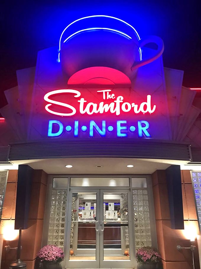 When the sun sets, that neon glow transforms into pure roadside poetry that demands your attention.