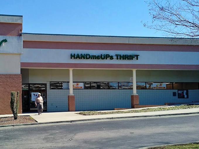 The welcoming entrance to HandmeUPs, where North Carolina sunshine highlights the promise of affordable retail therapy just steps away.