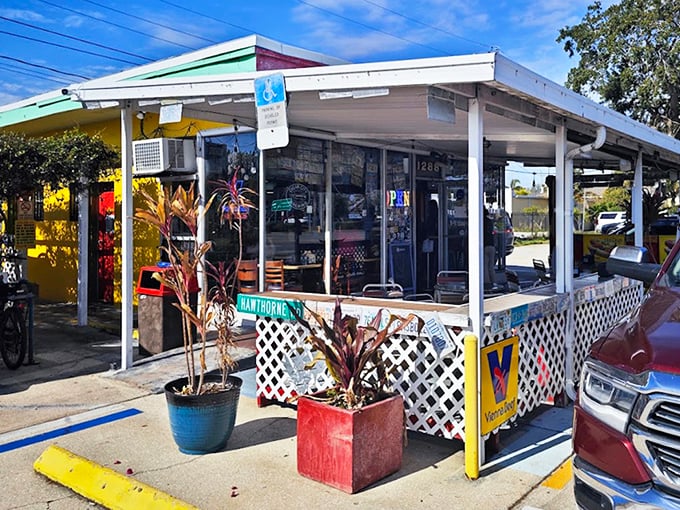 The welcoming exterior with its lattice fence and colorful planters says "come on in" even before your nose catches the scent of grilled franks.