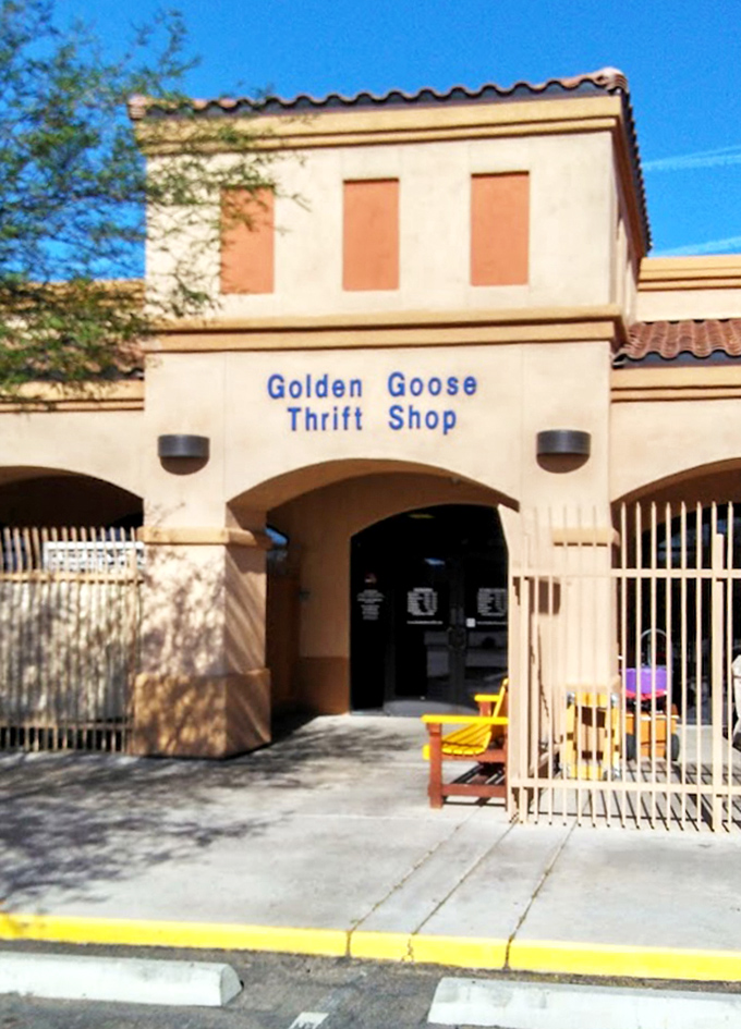 The inviting entrance with its distinctive southwestern architecture beckons bargain hunters. That yellow bench says "Rest here, you'll need your strength for shopping."