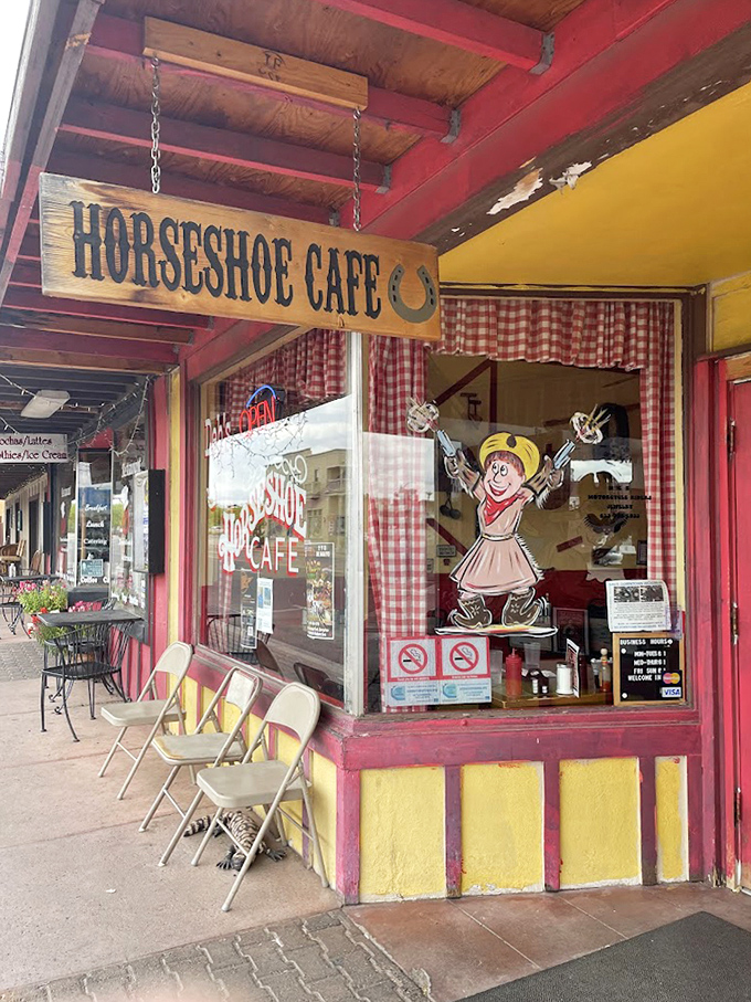 Outdoor seating under that iconic sign – perfect for people-watching while your breakfast settles into a food coma.