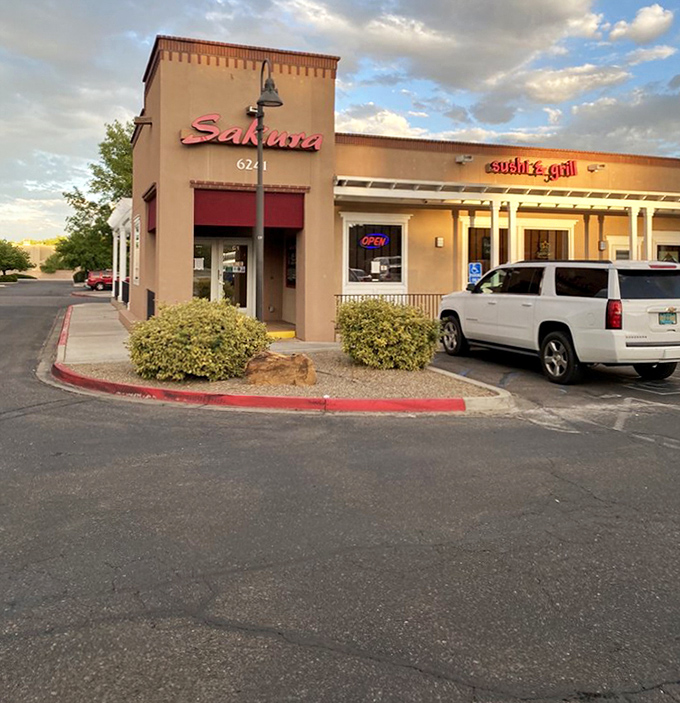 Sunset casts a golden glow on Sakura's exterior, signaling the transition from lunch to dinner service. The desert light makes even strip malls look magical.