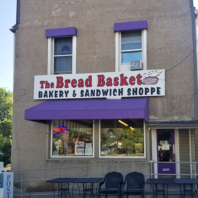 The purple awning and outdoor seating invite you to slow down and savor something special in downtown Cheyenne.