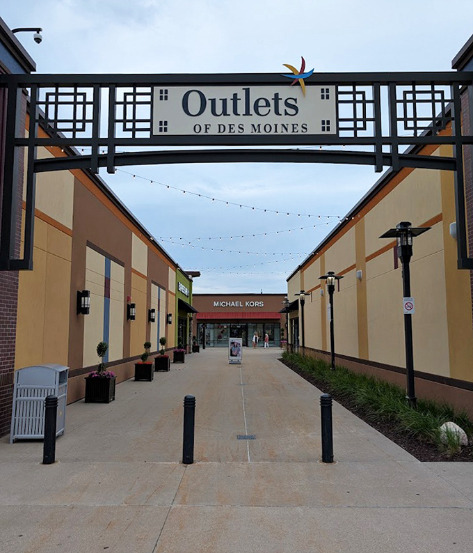 The welcoming entrance to shopping paradise, where string lights and clean lines promise a retail adventure more civilized than Black Friday anywhere else.