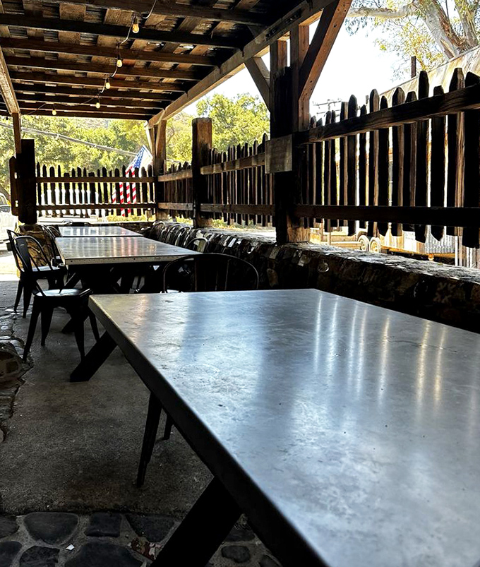 Outdoor dining that connects you to the California landscape&mdash;simple metal tables under a wooden canopy where fresh air seasons every bite.