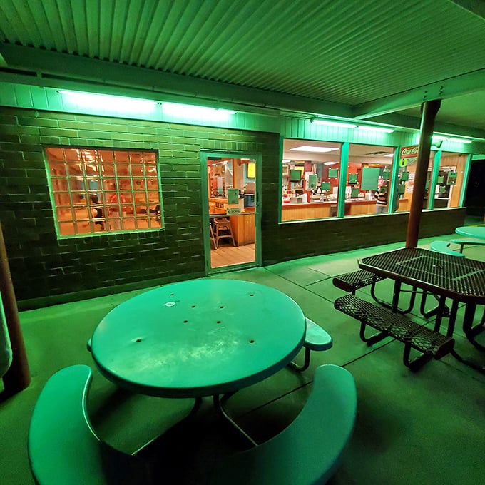 The outdoor patio glows with that distinctive aqua hue&mdash;like dining inside a vintage Chevy Bel Air's dashboard light.