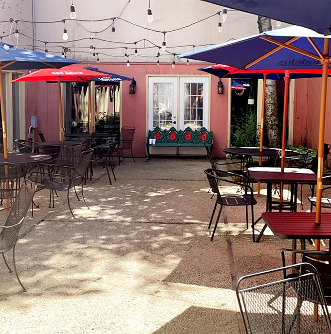 The patio feels like that secret spot you discovered on your last vacation&mdash;string lights, colorful umbrellas, and tables waiting for friends to gather.