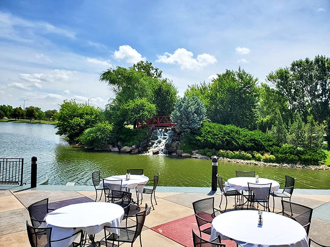 Waterside dining that transports you far from Kansas. This patio view with cascading waterfall might just convince you you're on vacation.