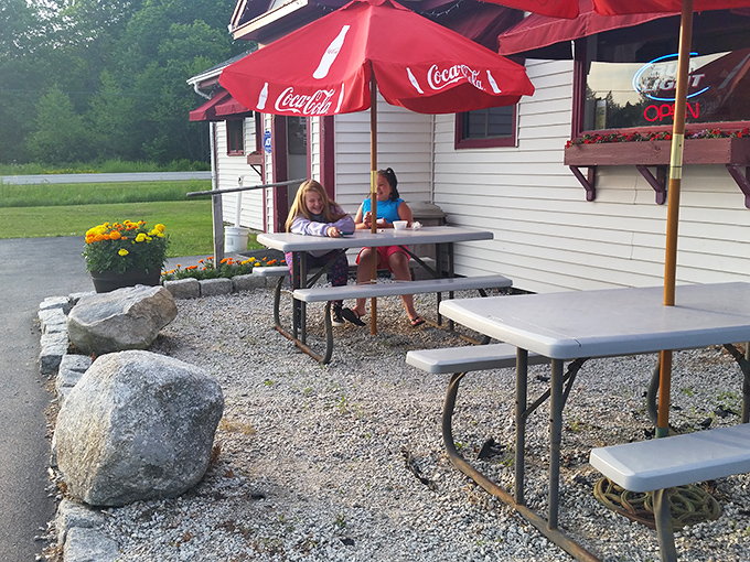 Outdoor seating under Coca-Cola umbrellas offers a casual alternative for enjoying Maine's perfect summer days alongside perfect fried seafood.