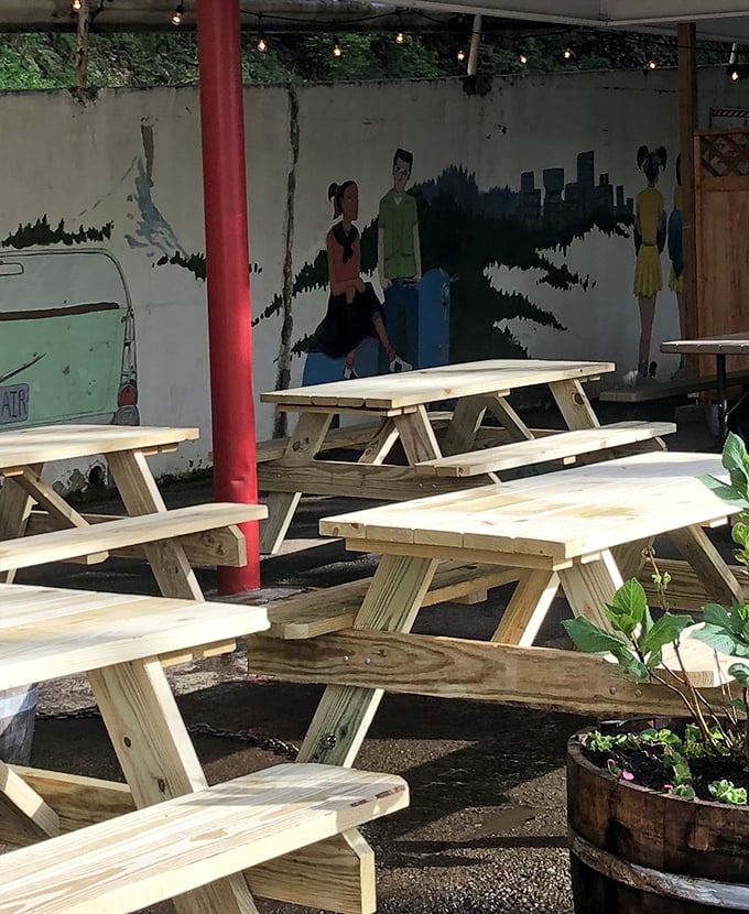 Outdoor picnic tables with a Portland skyline mural &ndash; urban dining with fresh air included.