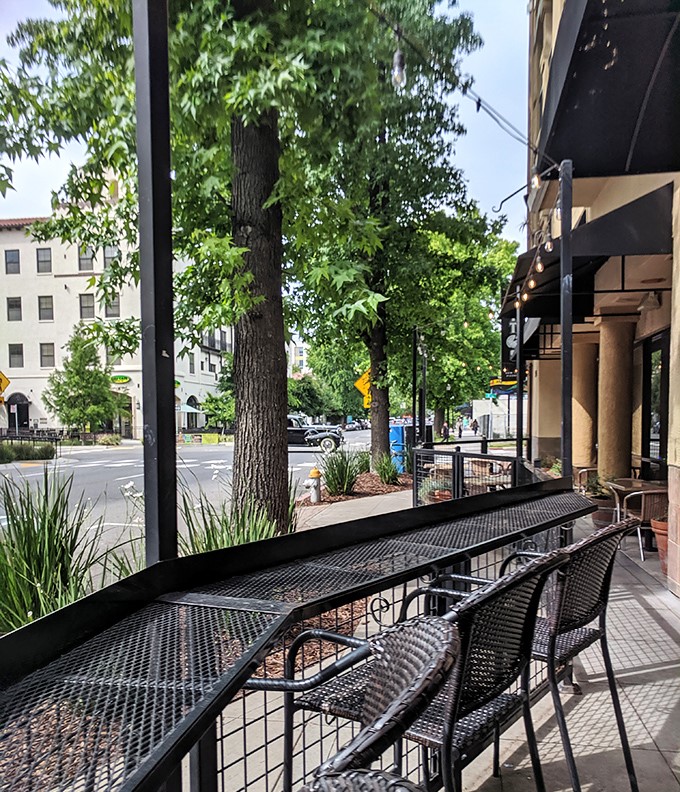 The sidewalk seating where pizza meets fresh air—a front-row seat to midtown Sacramento life with a slice in hand.