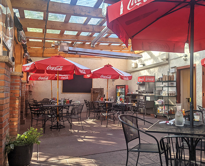 The outdoor patio &ndash; where breakfast meets fresh air under a canopy of Coca-Cola umbrellas. Colorado's sunshine makes everything taste better.