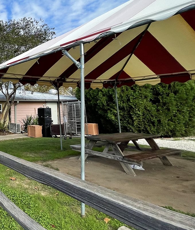 Outdoor seating under a striped awning offers a taste of Texas sunshine with your meal&mdash;picnic tables that have hosted countless summer gatherings.